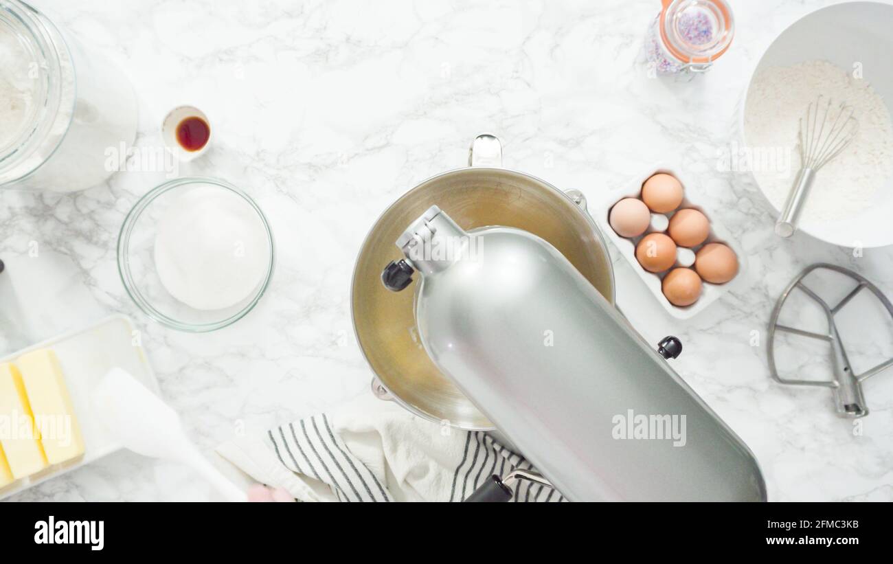 Step by step. Flat lay. Mixing ingredients in standing kitchen mixer to ...
