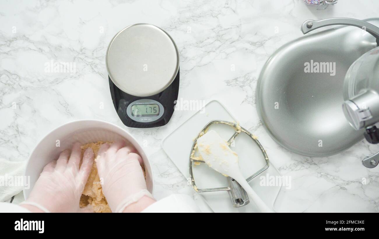 Step by step. Flat lay. Measuring cookie dought with a digital kitchen ...