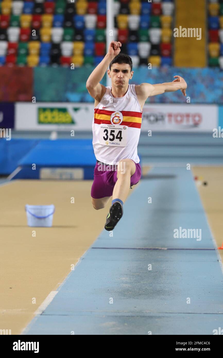 ISTANBUL, TURKEY - FEBRUARY 14, 2021: Undefined athlete triple jumping ...