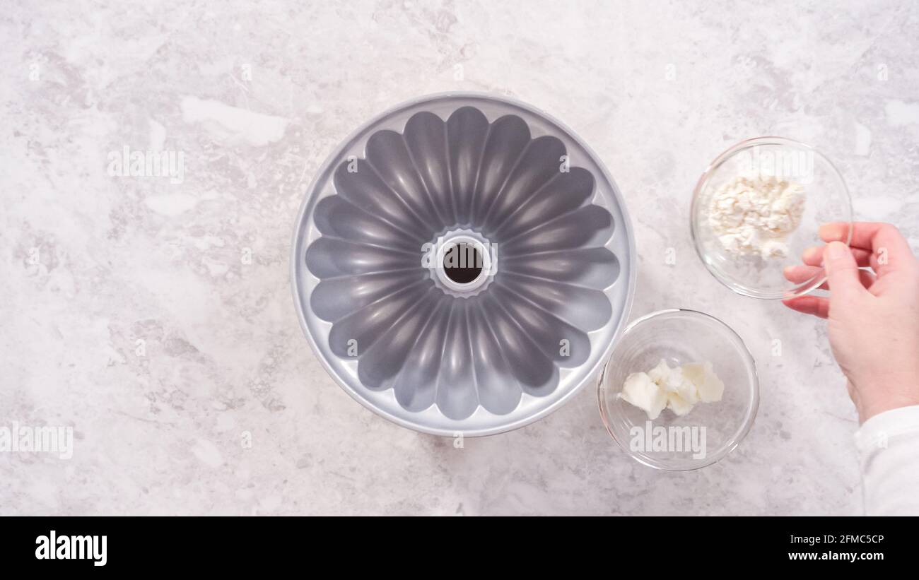 Flat lay. Step by step. Greasing bundt cake pan with vegetable ...