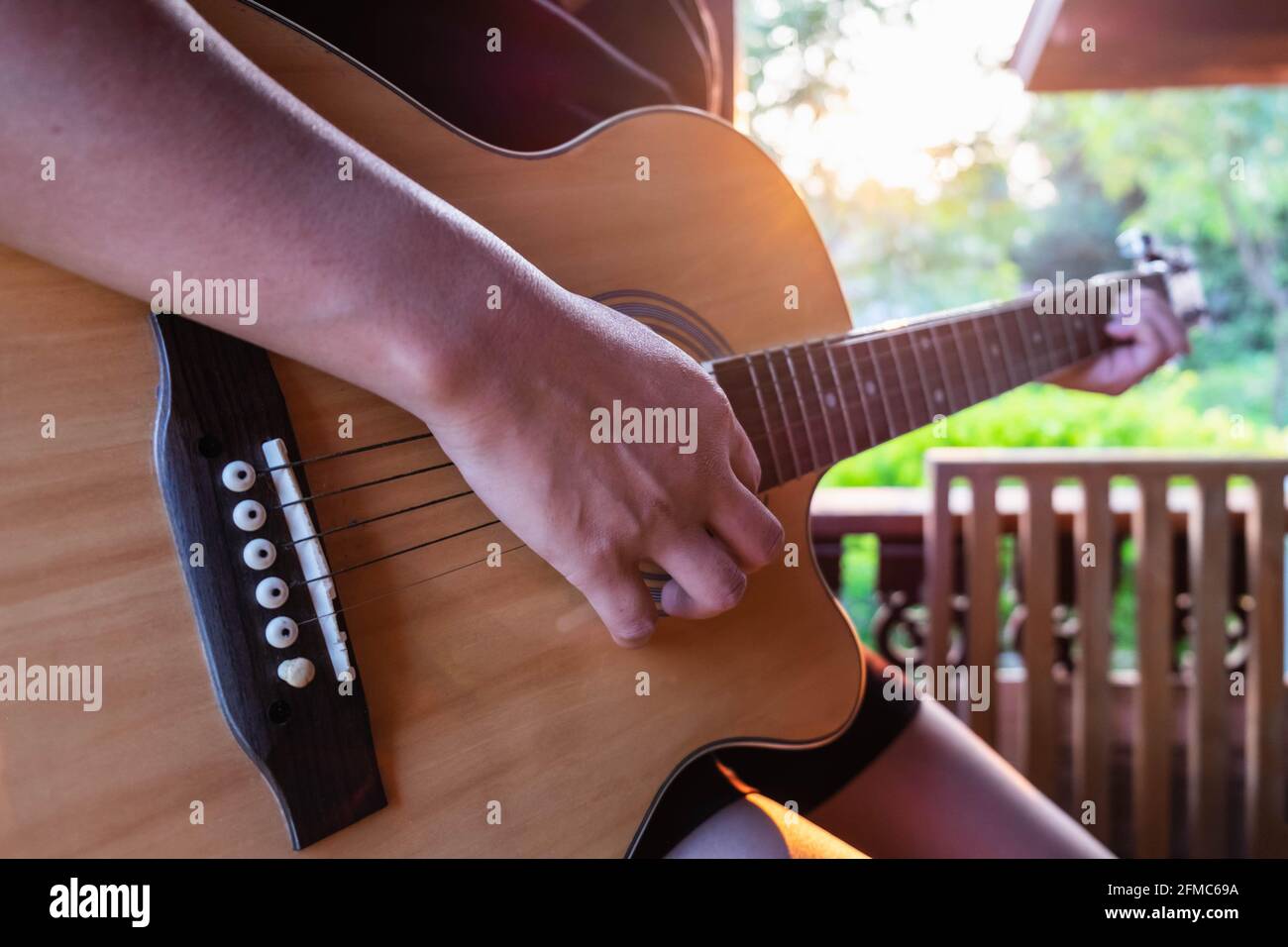 Female musician playing classical guitar Stock Photo - Alamy