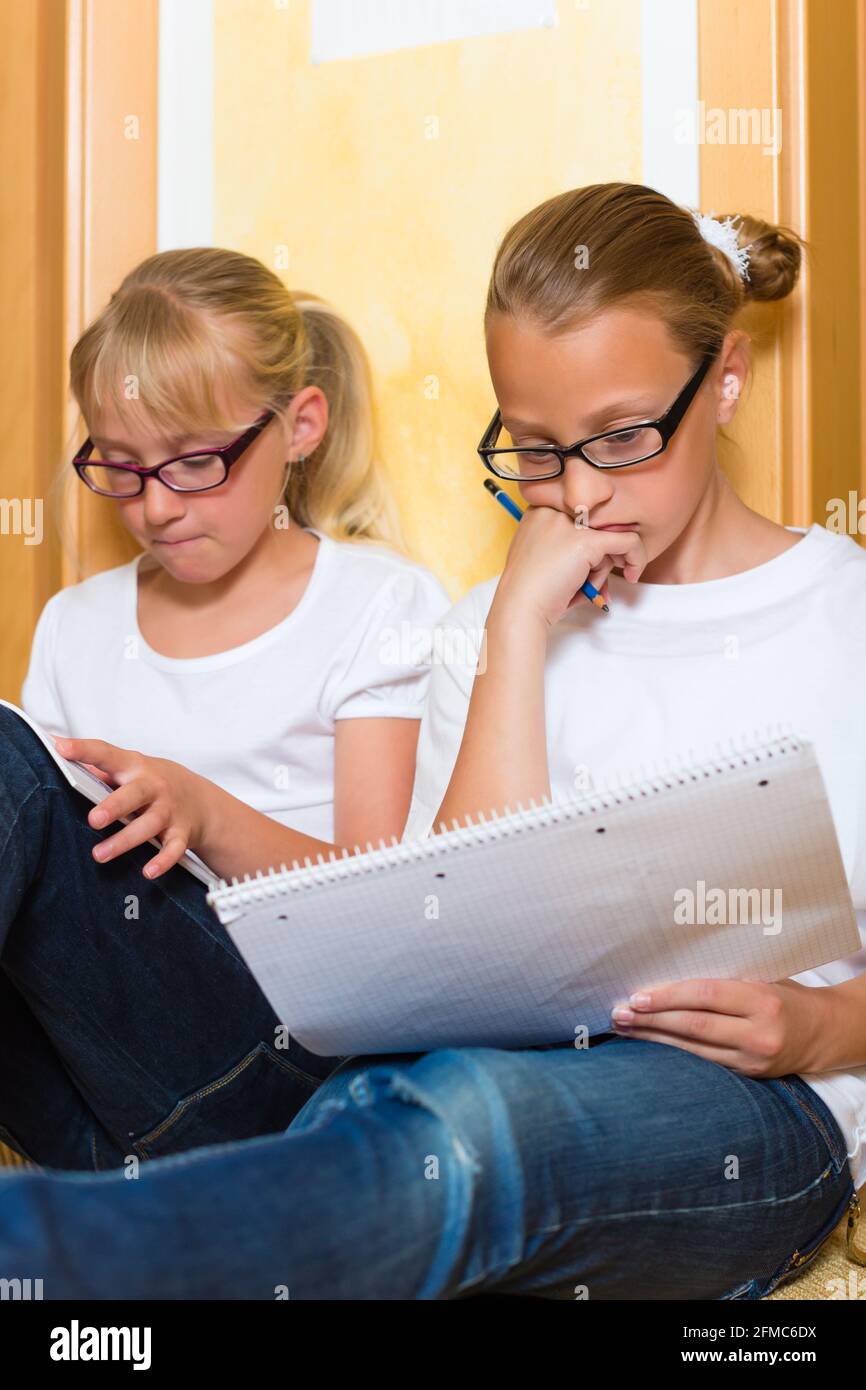 Child helping friend at school hi-res stock photography and images - Alamy