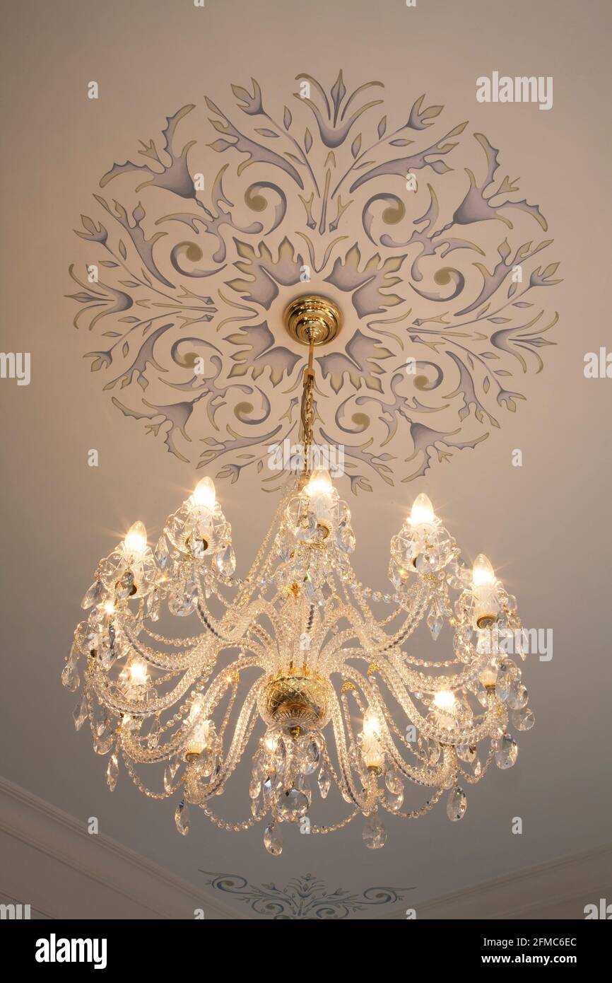 Chandelier on ceiling with pattern Stock Photo - Alamy