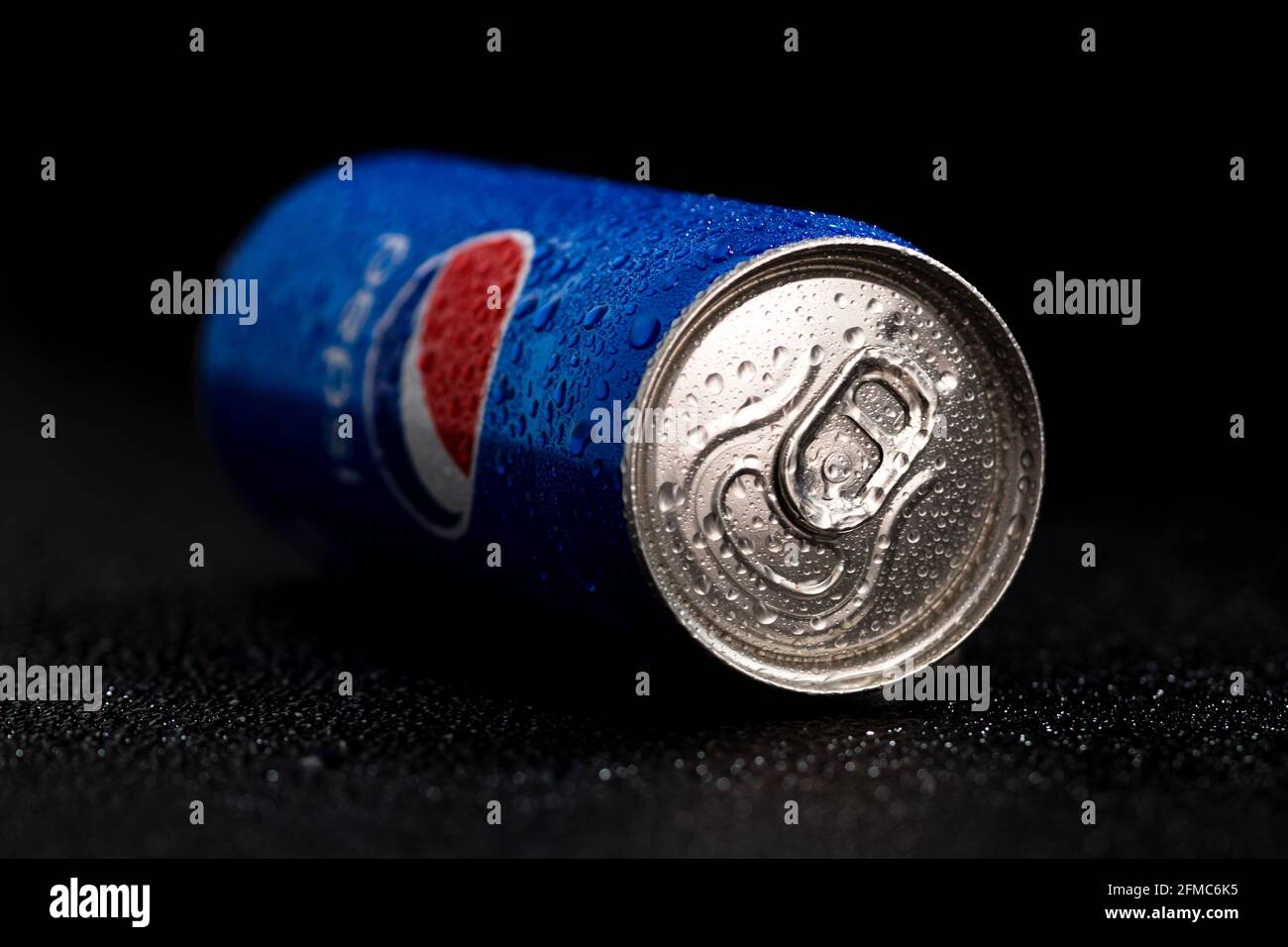 Editorial photo of Pepsi can with water droplets on black background ...