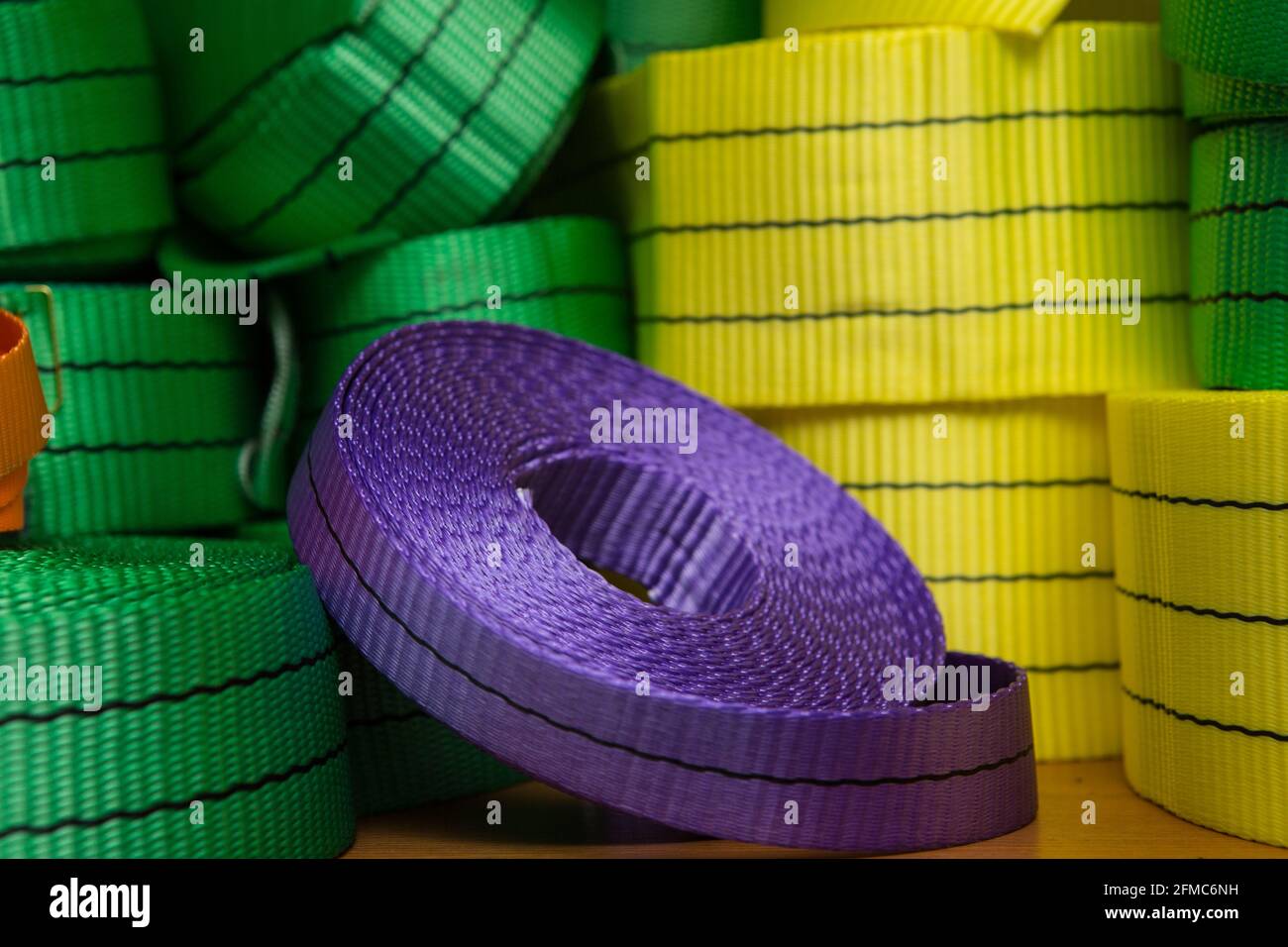 Industrial sewing machine sews a webbing sling. Manufacture of textile ...