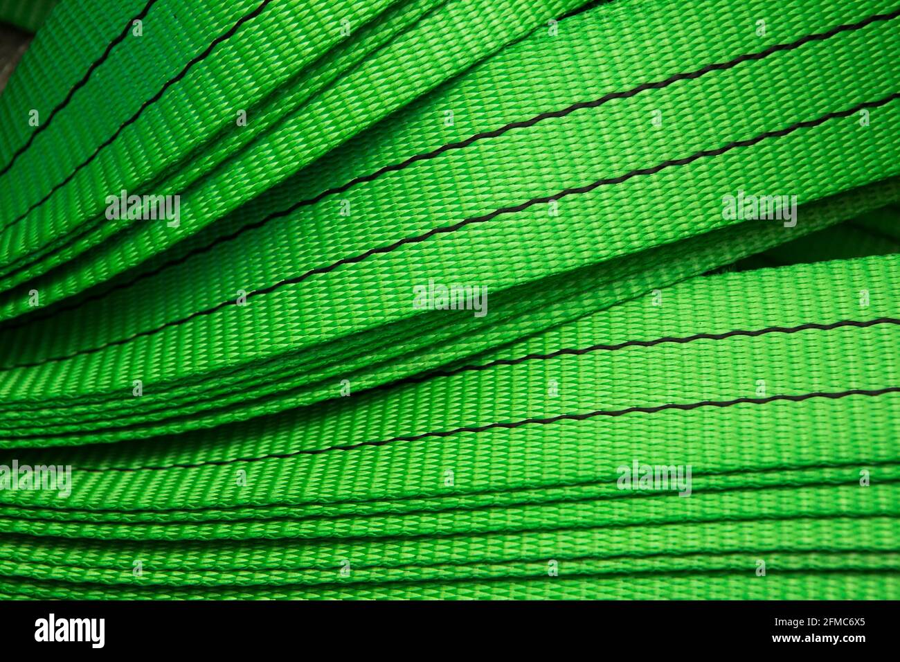 Industrial sewing machine sews a webbing sling. Manufacture of textile ...