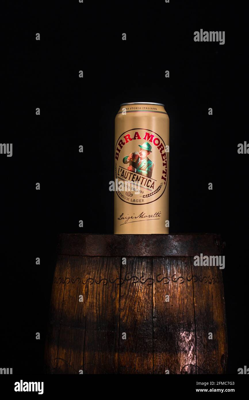 Can of Birra Moretti beer on wooden barrel with dark background ...