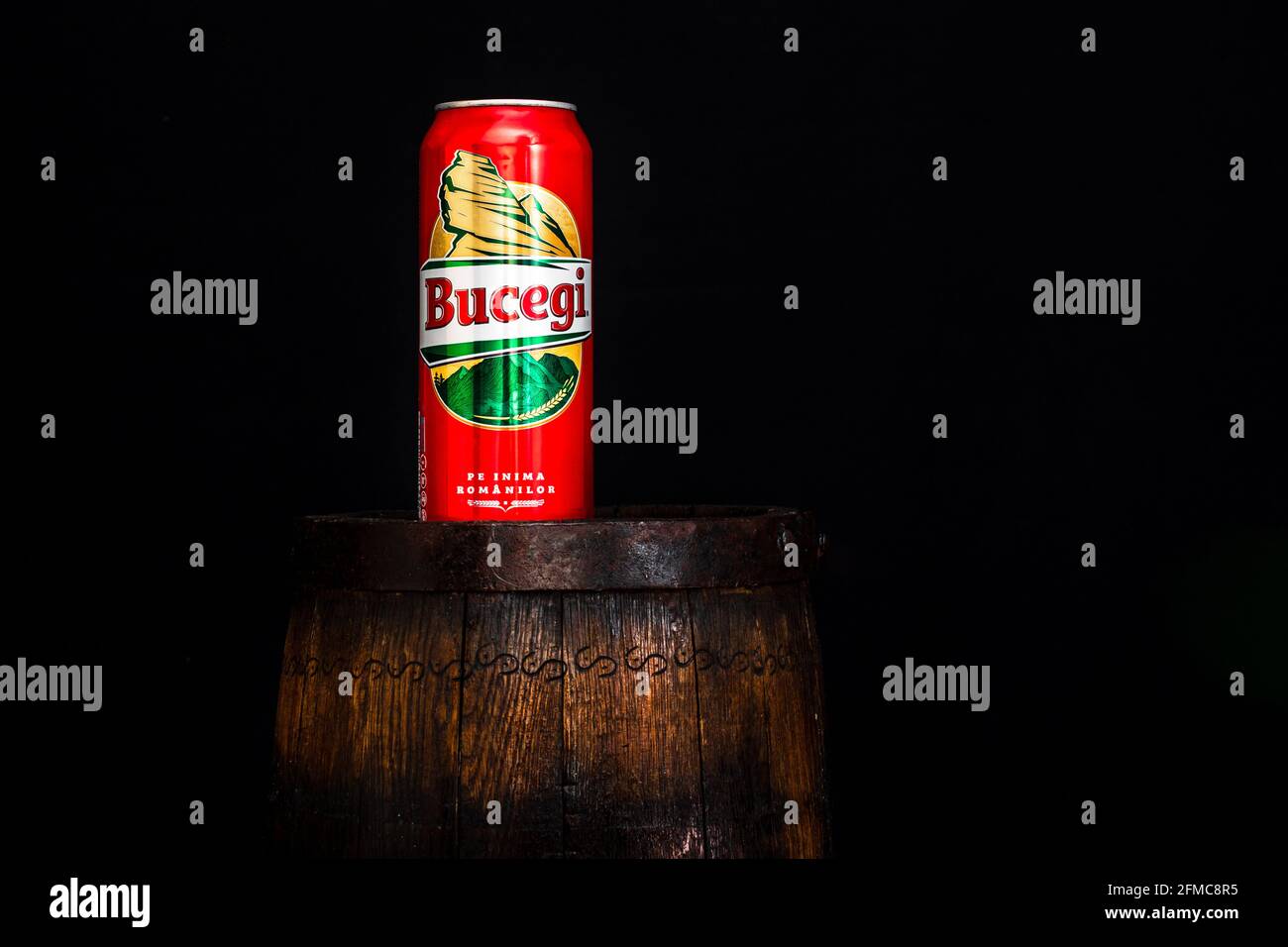 Can of Bucegi beer on beer barrel with dark background. Illustrative ...