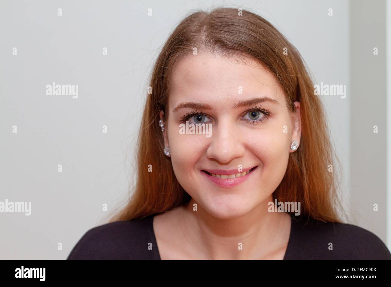 Headshot of a smiling beautiful Russian lady Stock Photo - Alamy
