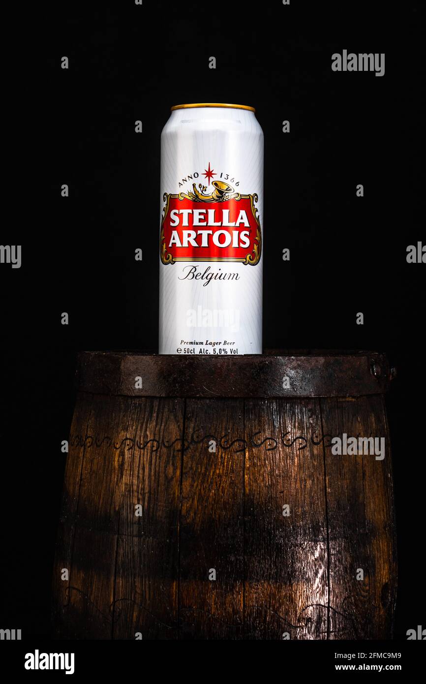 Can of Stella Artois beer on beer barrel with dark background ...