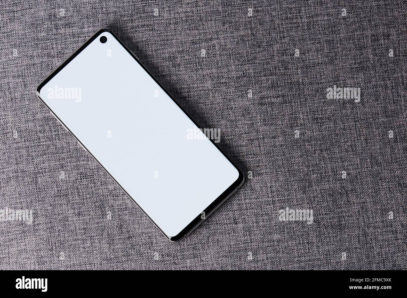 Modern smartphone on fabric background above top view Stock Photo - Alamy