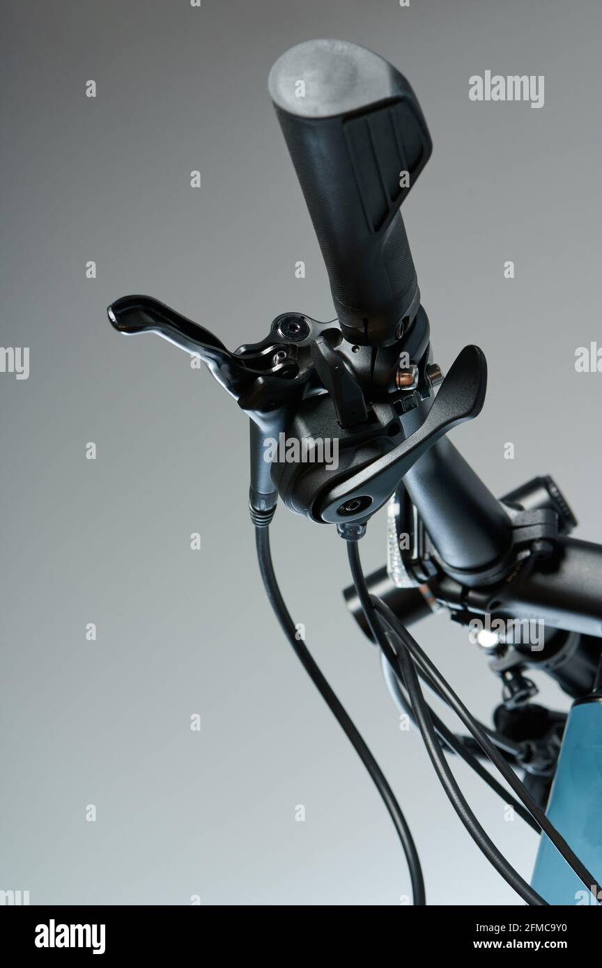 Black wires on bicycle handle bar close up view Stock Photo - Alamy