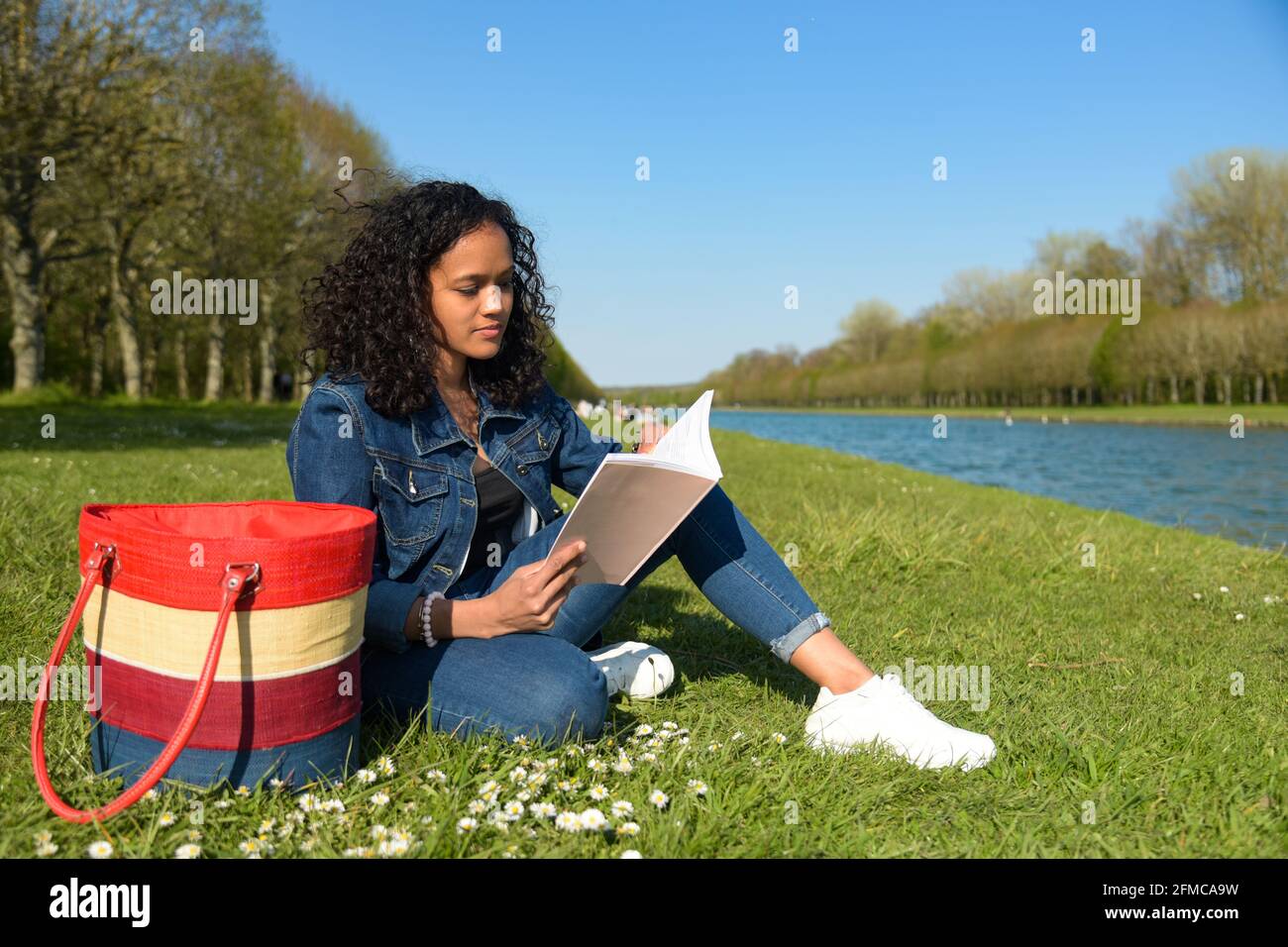 metis woman reading in nature Stock Photo - Alamy