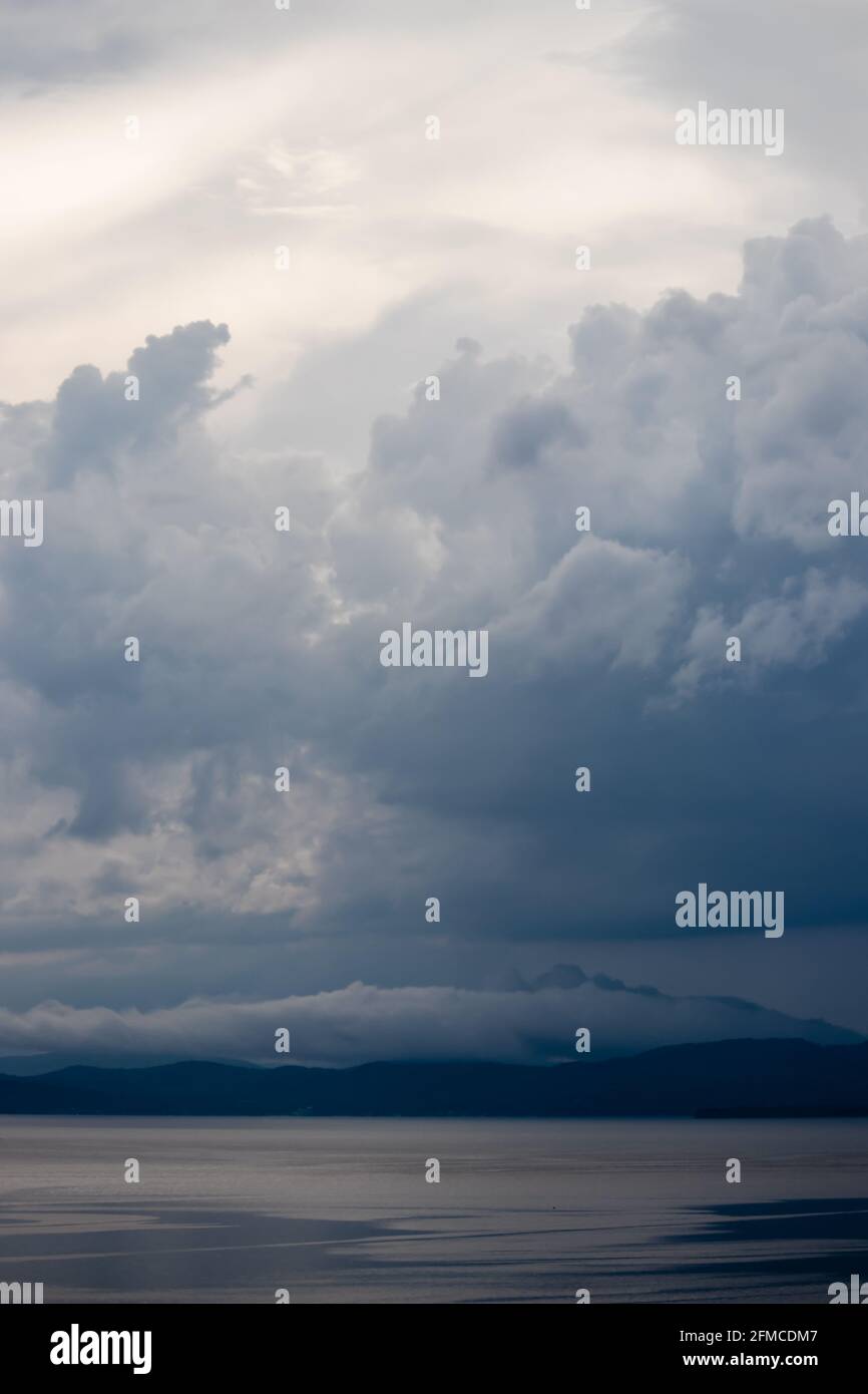 Ominous clouds over lake hi-res stock photography and images - Alamy