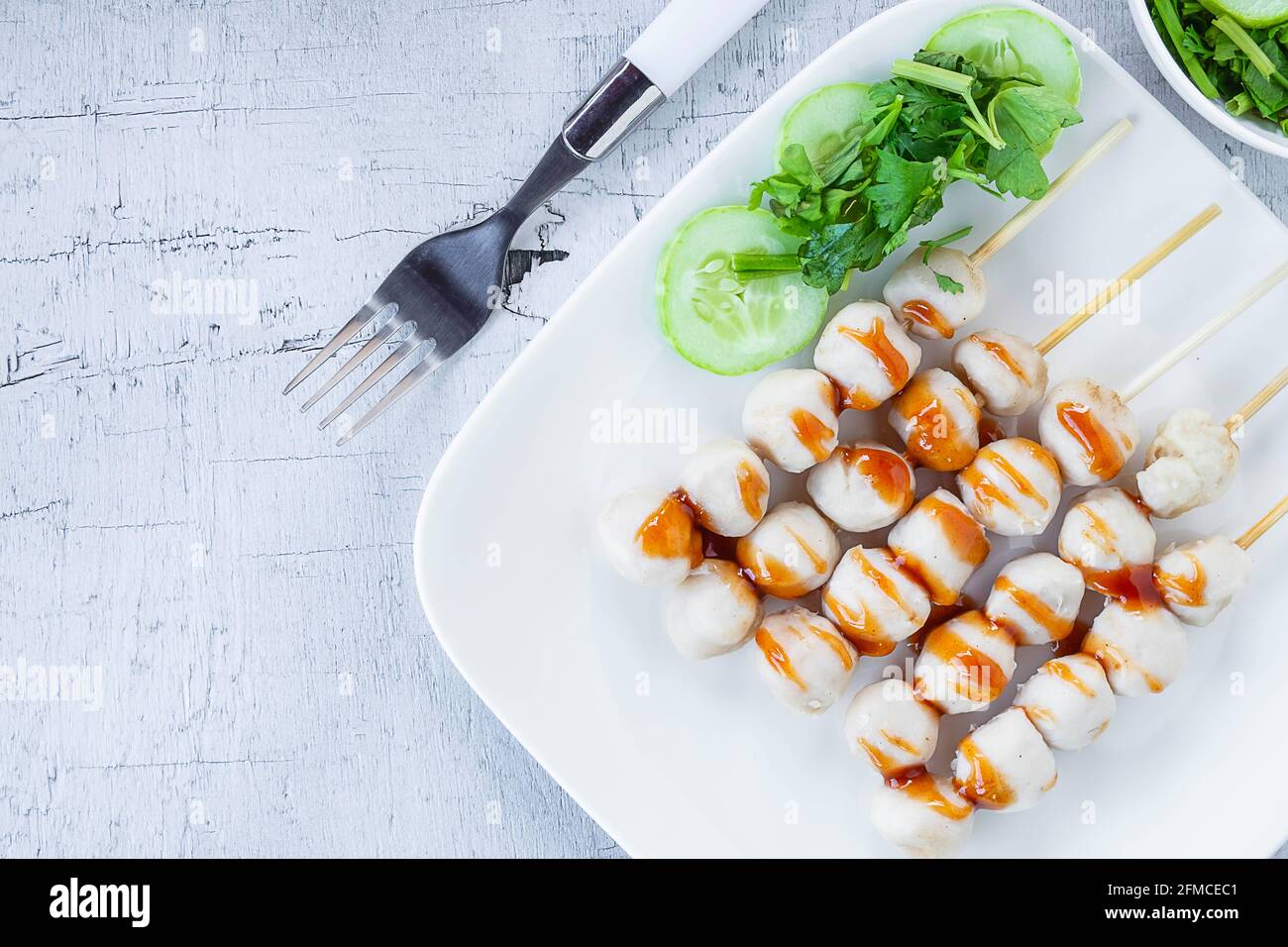 Grilled meatballs with dipping sauce Stock Photo - Alamy