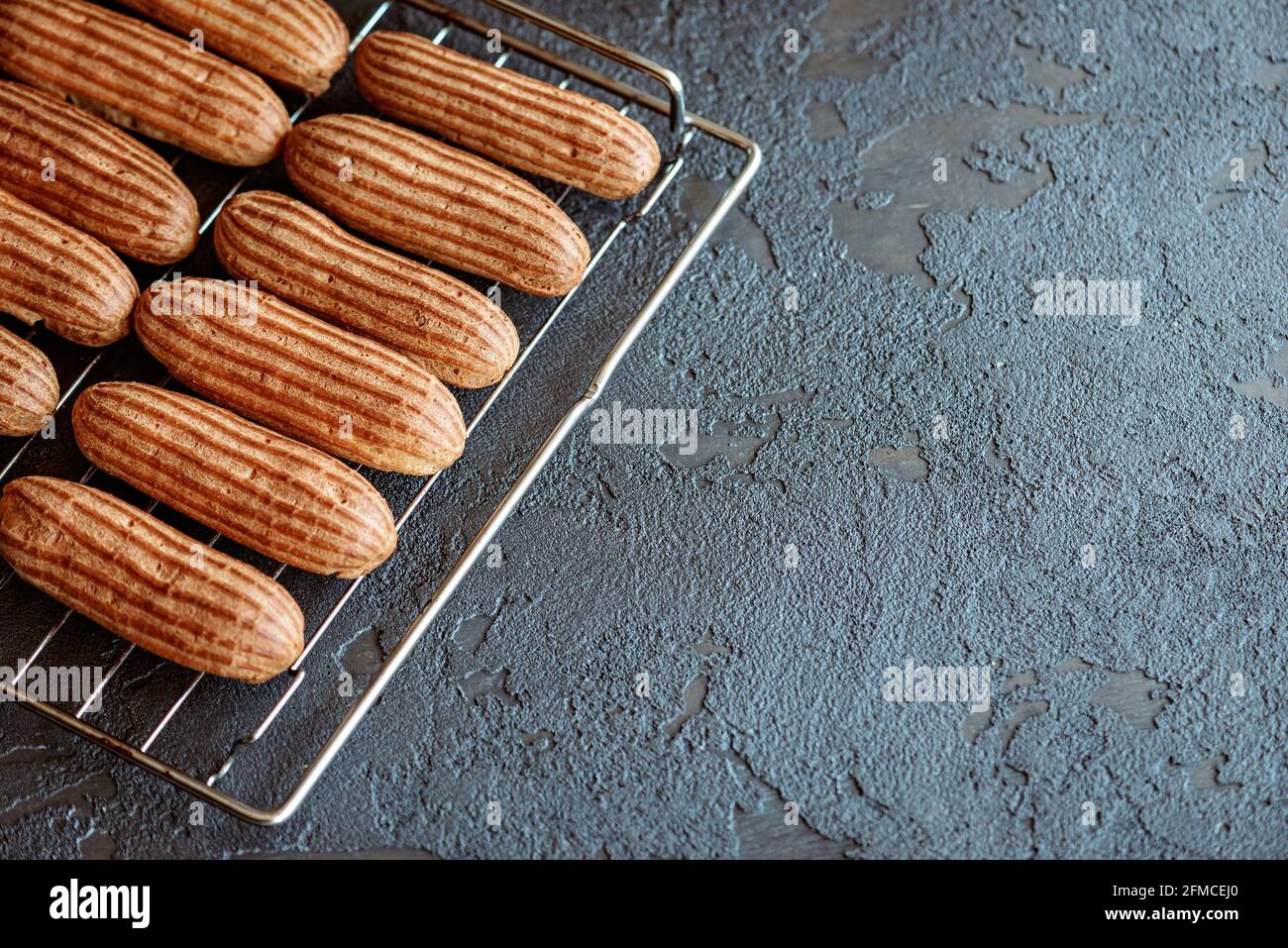 French pastry dessert eclair. Freshly baked aromatic custard cakes cool ...