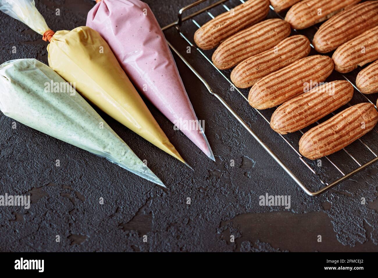 French pastry dessert eclair. Freshly baked aromatic custard cakes cool ...