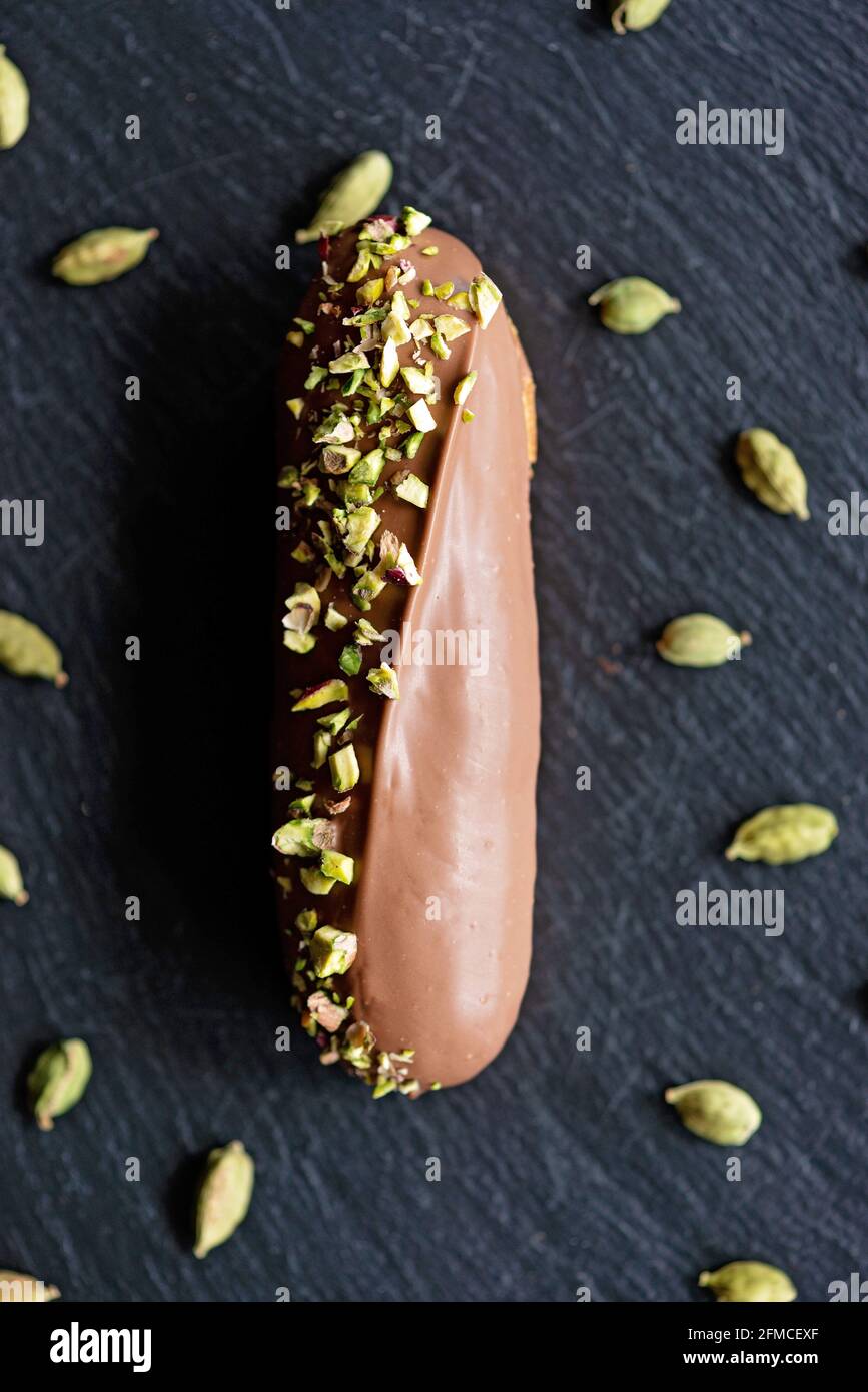 French dessert eclairs or profiteroles with milk chocolate glaze ...