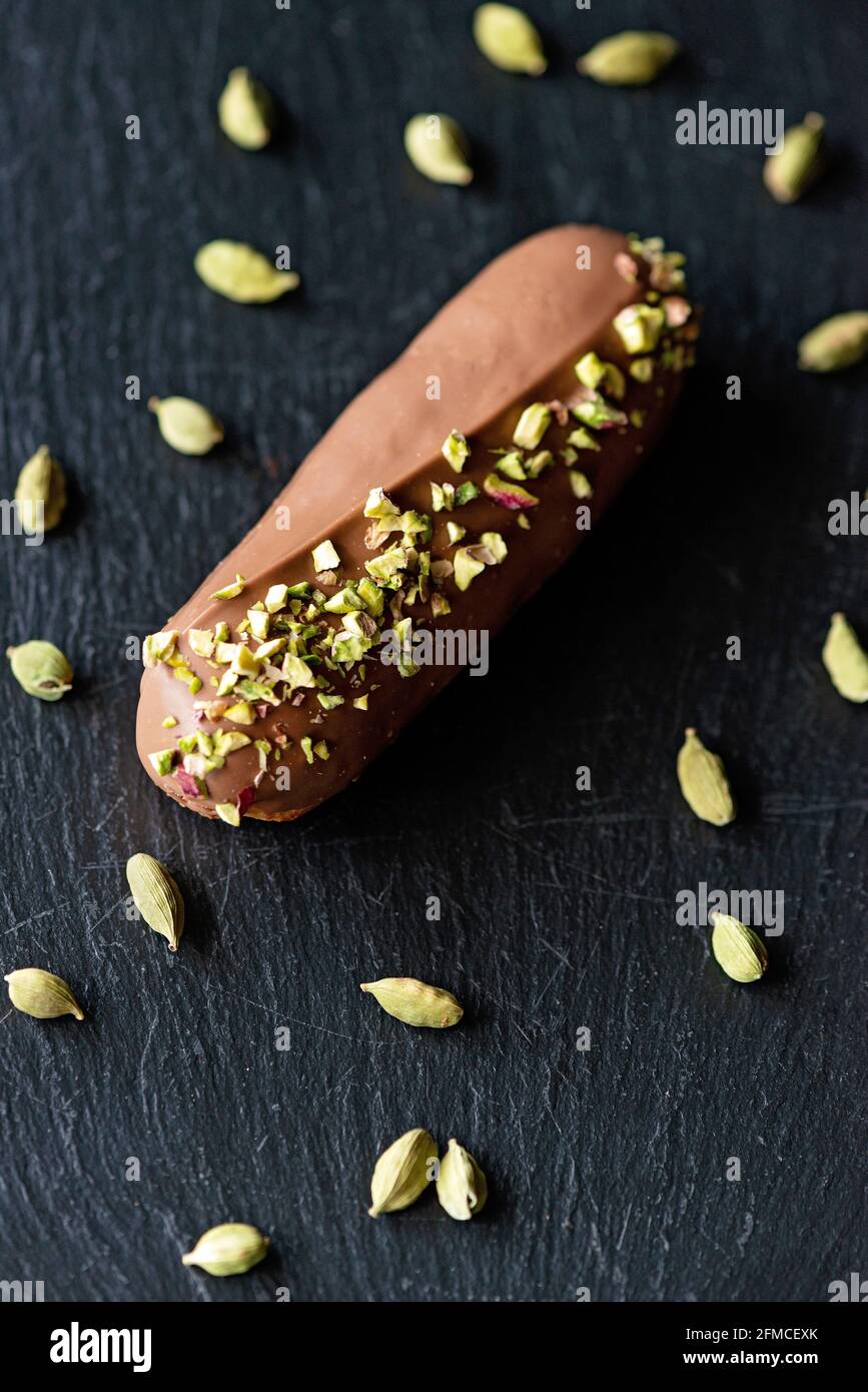 French dessert eclairs or profiteroles with milk chocolate glaze ...