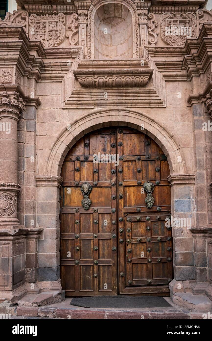 Massive wooden doors with colonial intrigue dominate the street scene ...
