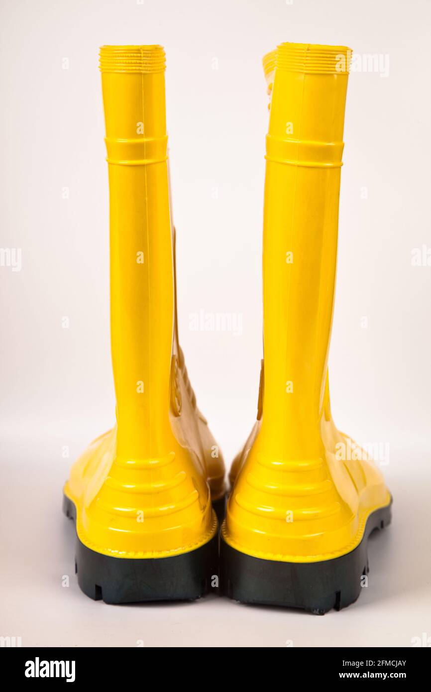 Robust and waterproof yellow rubber boots isolated on white background ...