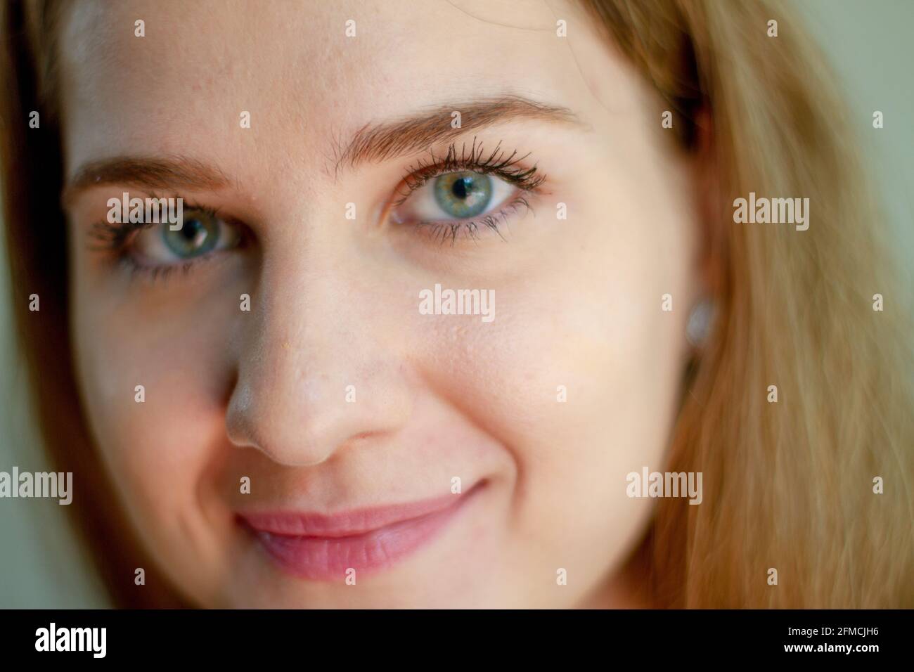 Pretty face of a beautiful smiling female Stock Photo - Alamy