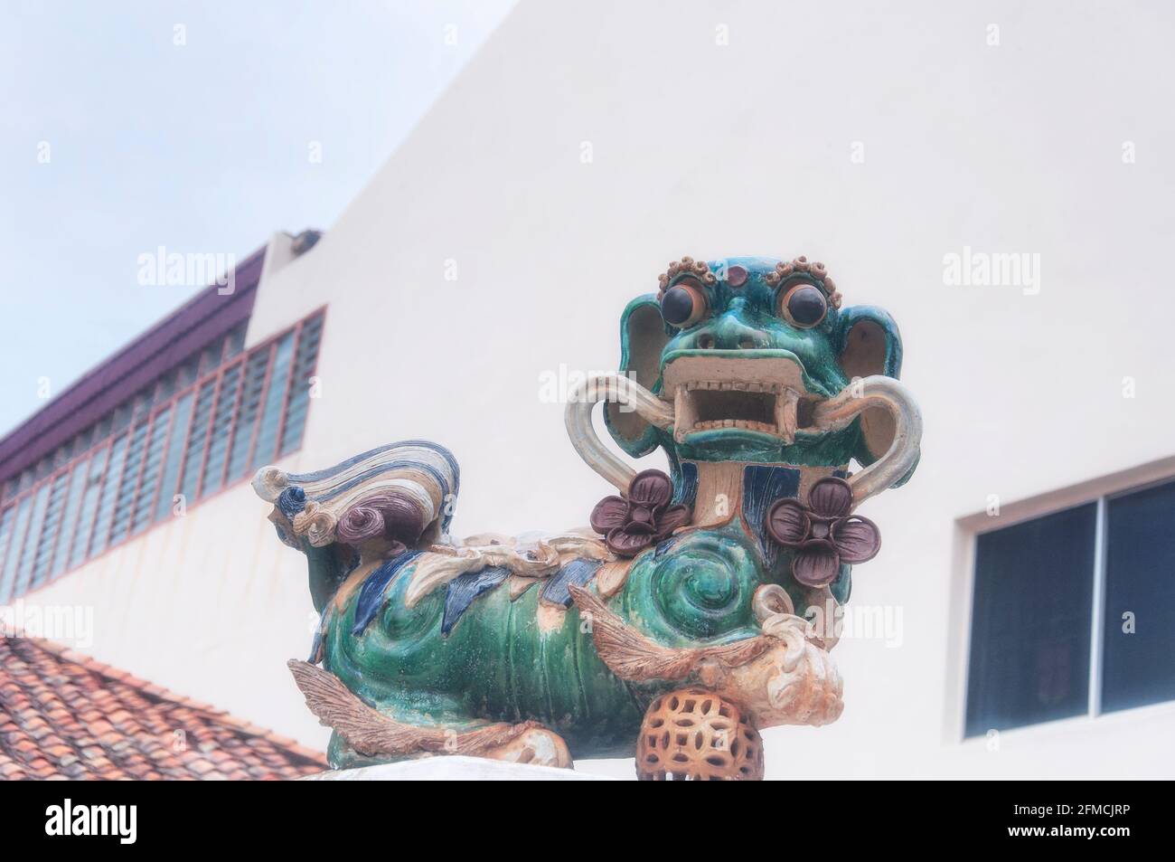 A Kylin Statue Within The Xiang Lin Si Buddhist Temple In Melaka Malaysia With A Blurred White
