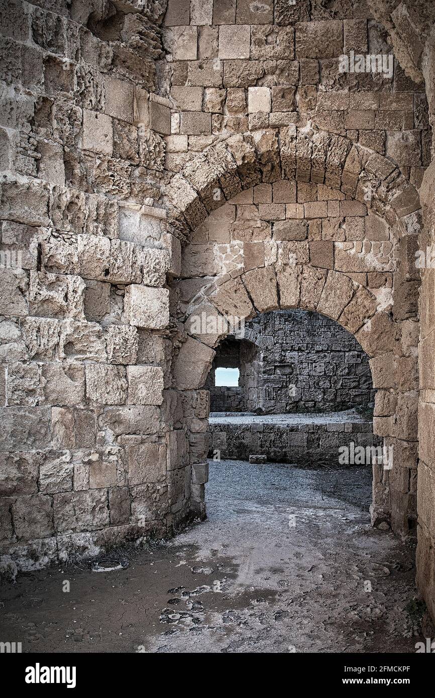A gateway arch at the ancient city wall at Rhodes old town in Greece ...