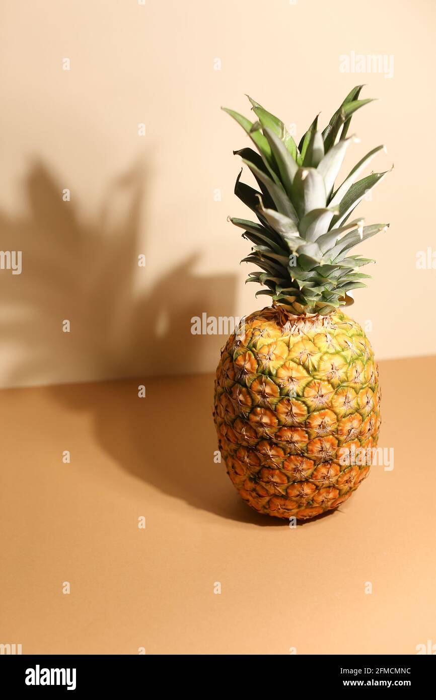 Pineapple isolated on neutral beige background Stock Photo - Alamy