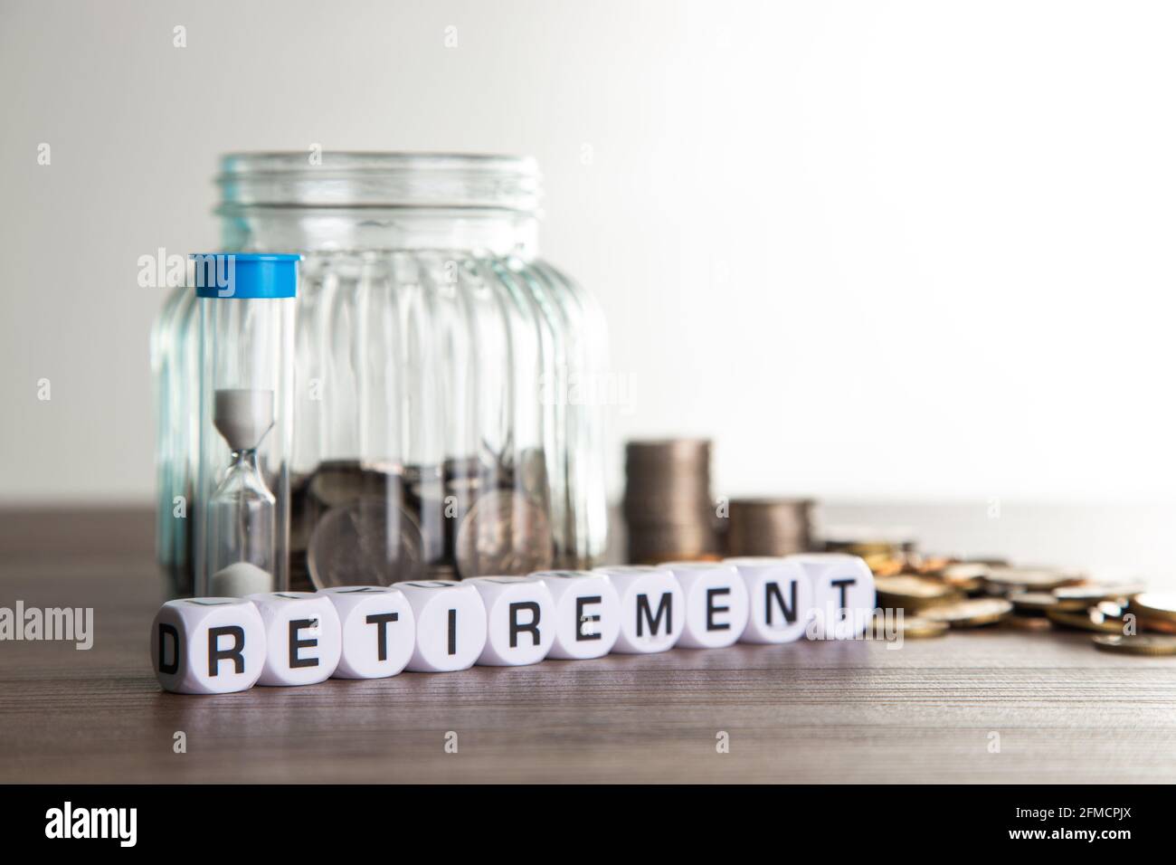 Saving money for retirement plan. Retirement Conceptual Stock Photo - Alamy