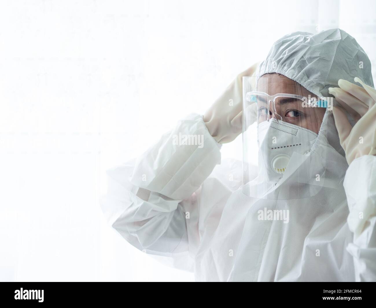 woman doctor in PPE (Personal Protective Equipment) for working in ...
