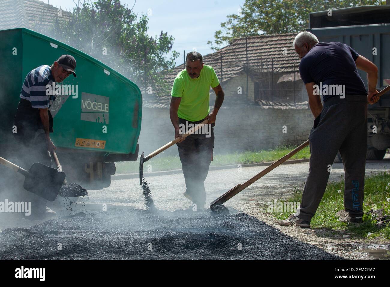 Mihaltsi, Bulgaria - May 7 2021: Workers leveling asphalt on a road ...
