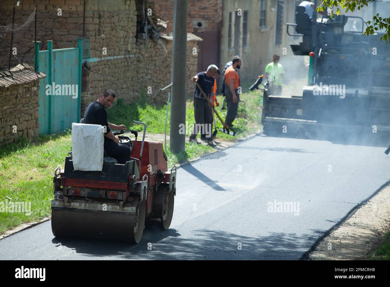 Construction worker spreading gravel hi-res stock photography and ...