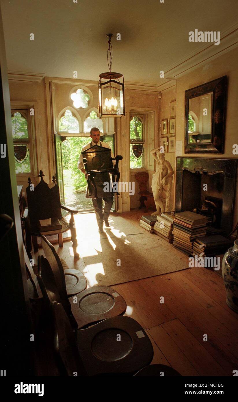 A CHRISTIES WORKER SEPTEMBER 2000 CARRIES IN A GEORGE 2 MAHOGANY CHAIR ...