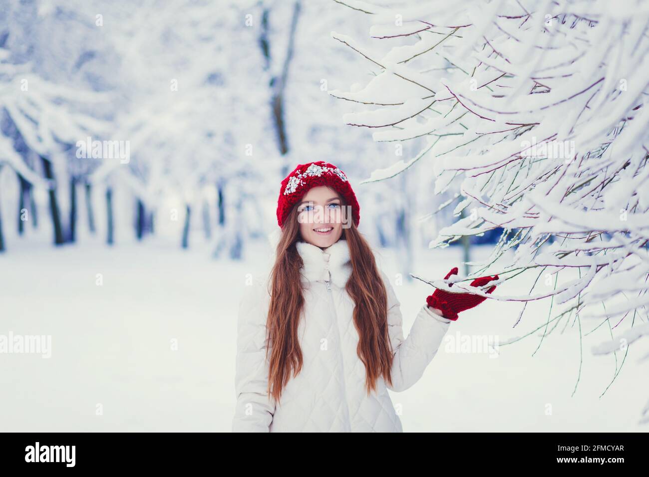 portrait of a beautiful girl with blue eyes in a hat in winter Stock ...