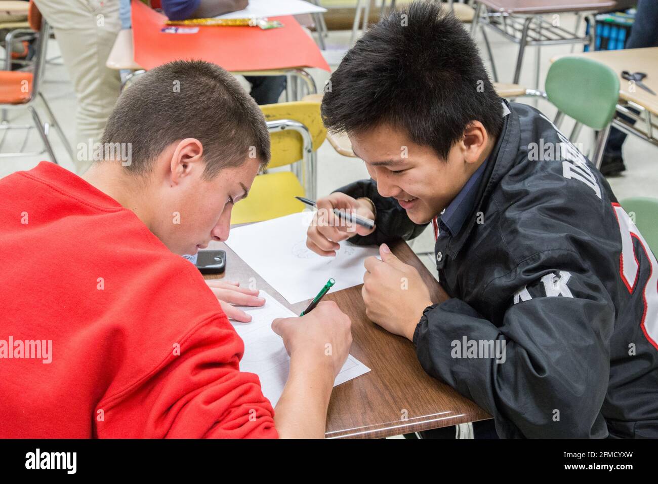 High school students working together in the classroom Stock Photo - Alamy