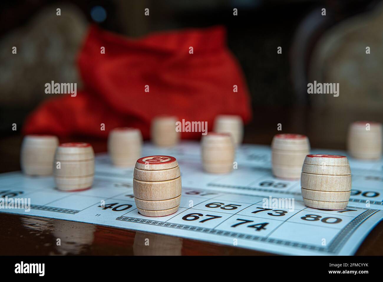 Lotto game. Wooden lotto barrels and card for a game in lotto on a gray ...