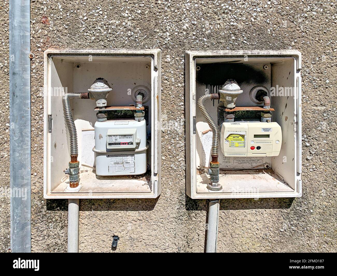 Two gas diahragm meters on exterior wall of building Stock Photo - Alamy