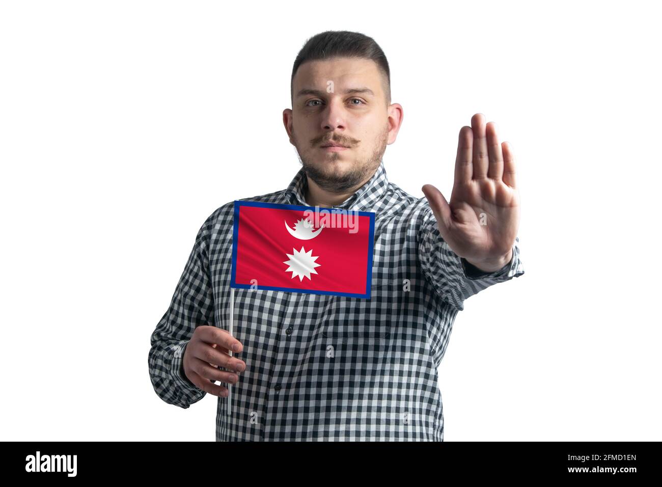 White guy holding a flag of Nepal and with a serious face shows a hand ...