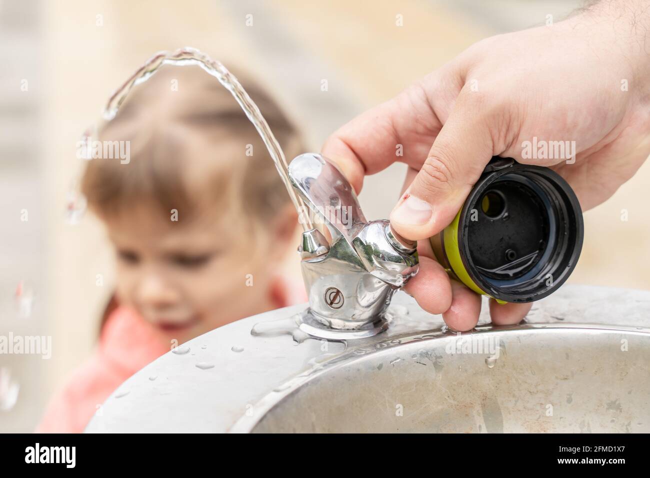 fountains with drinking water in the park. the child came to drink ...