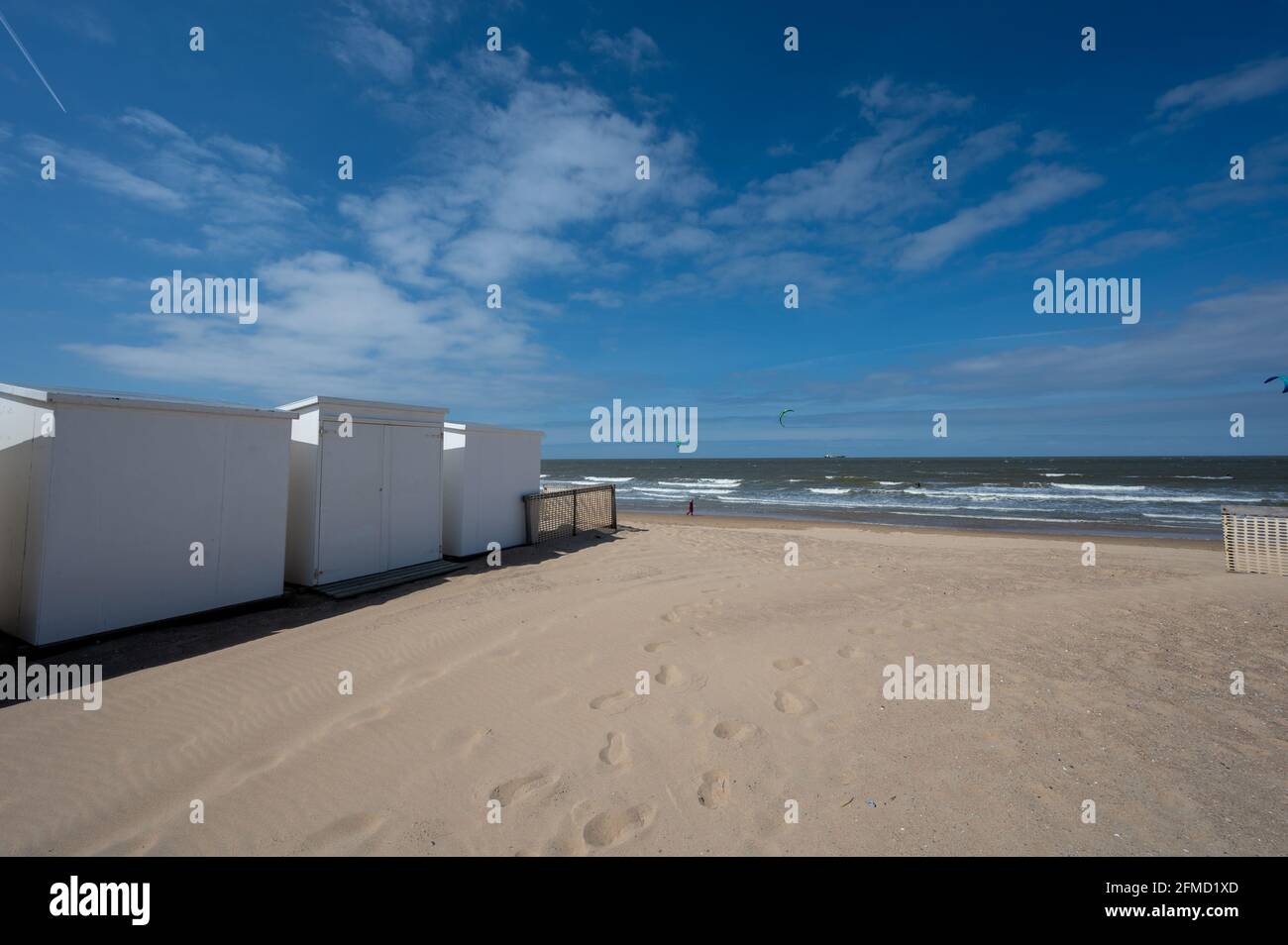 White beach huts on yellow sandy beaches in small Belgian town Knokke ...