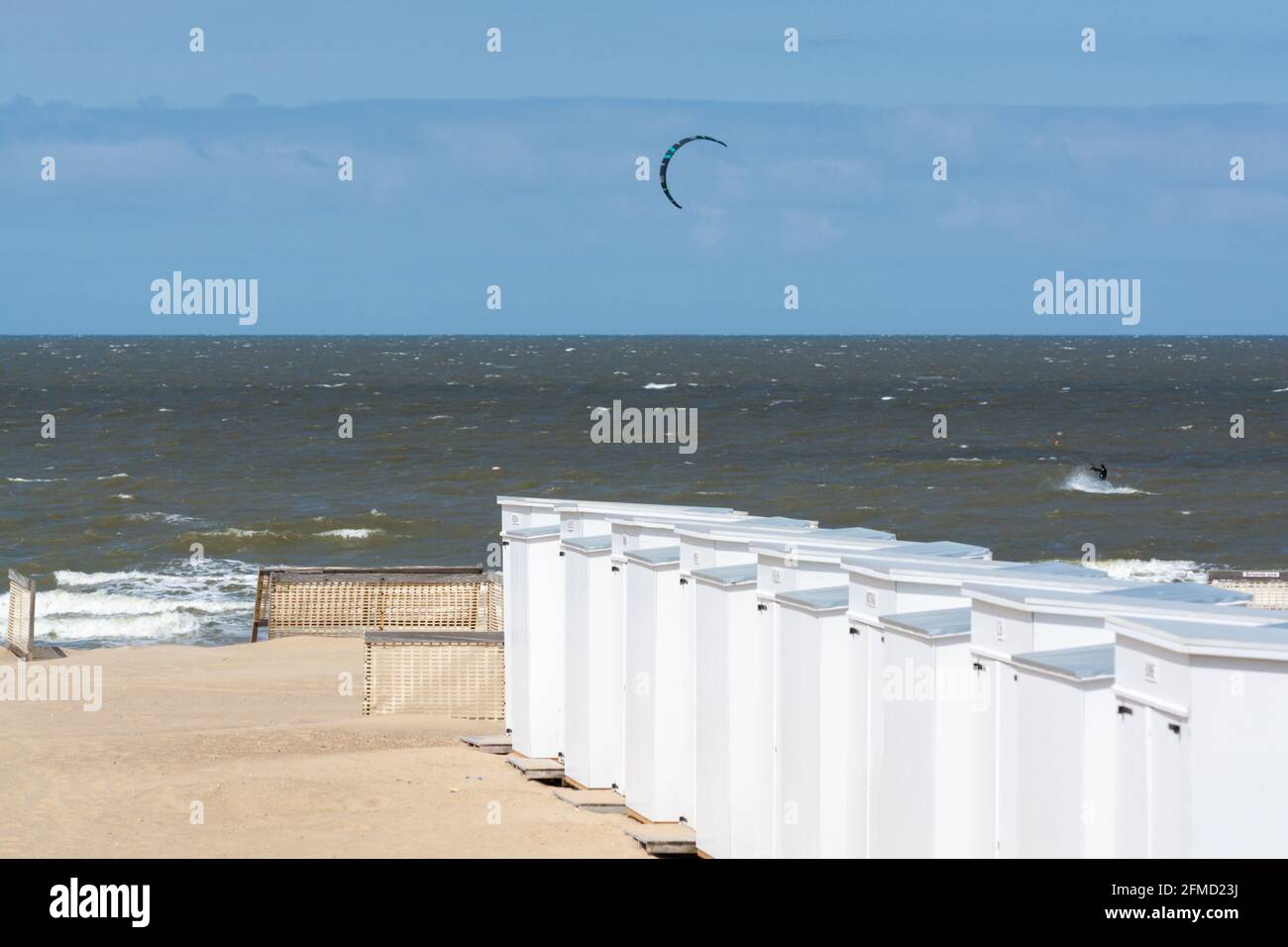 White beach huts on yellow sandy beaches in small Belgian town Knokke ...