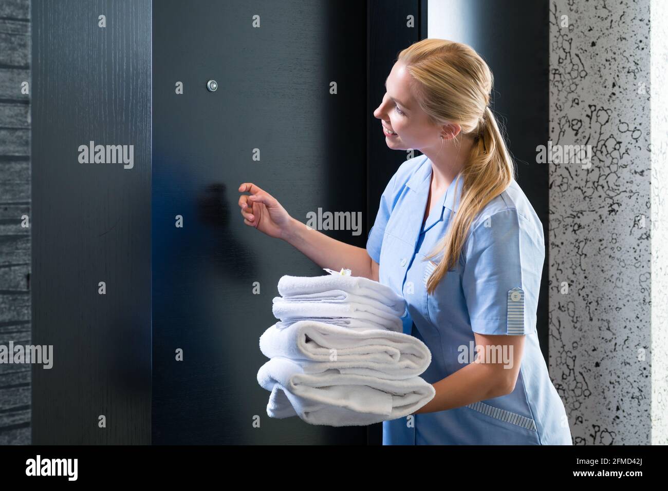 Maid knocking door hi-res stock photography and images - Alamy