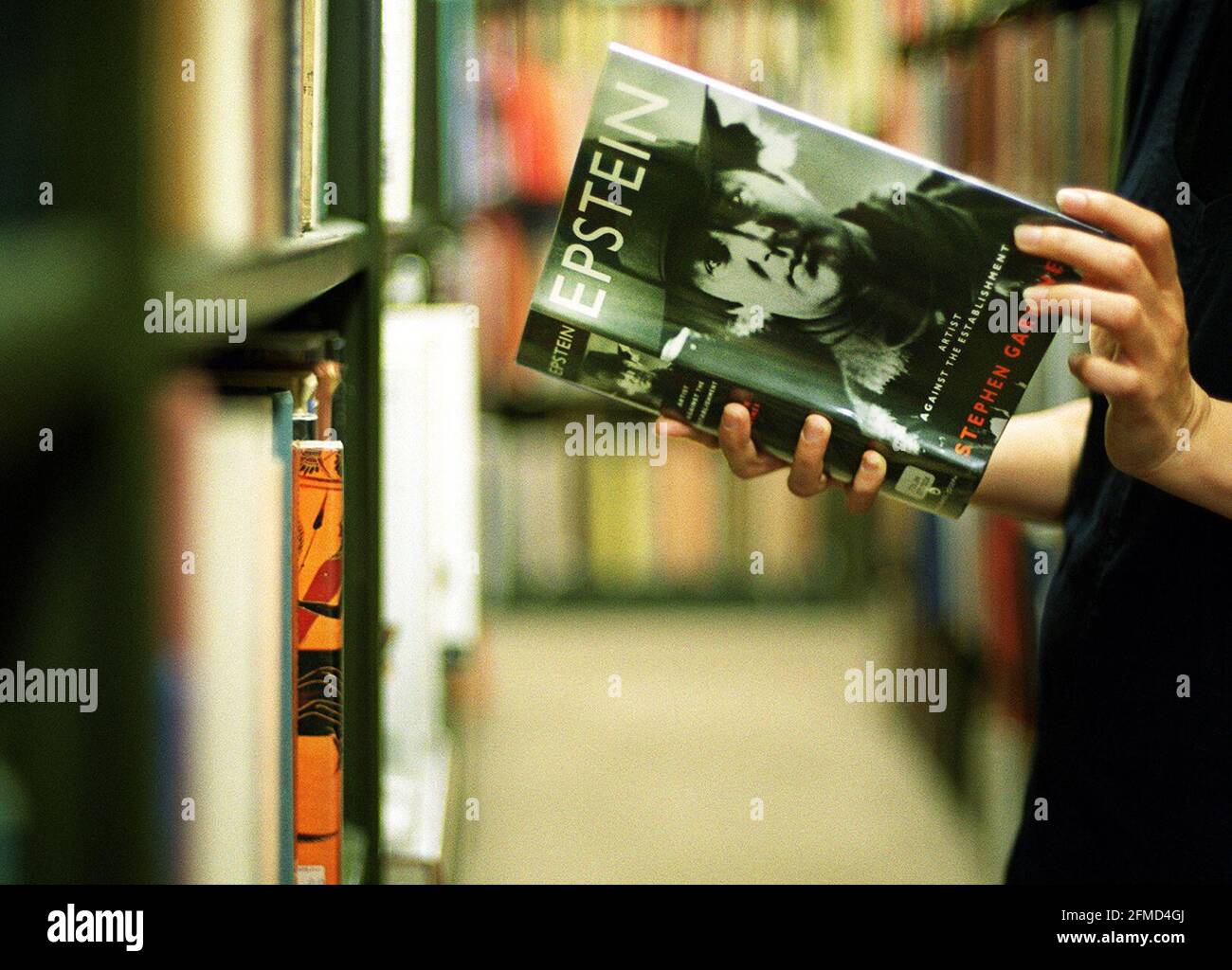SOMEONE IN A LIBRARY Stock Photo - Alamy