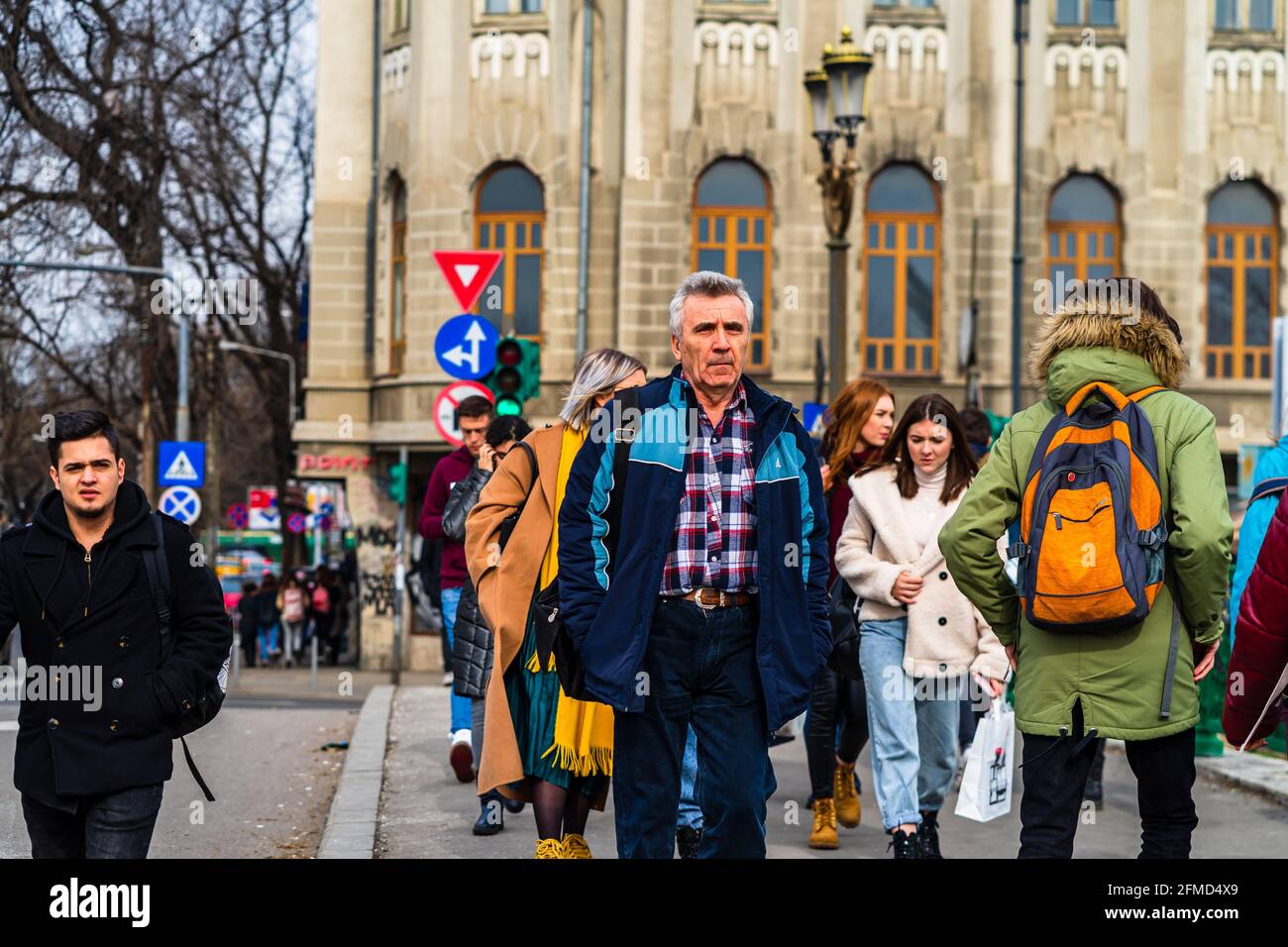 People moving, walking on the streets in downtown of Bucharest, Romania ...