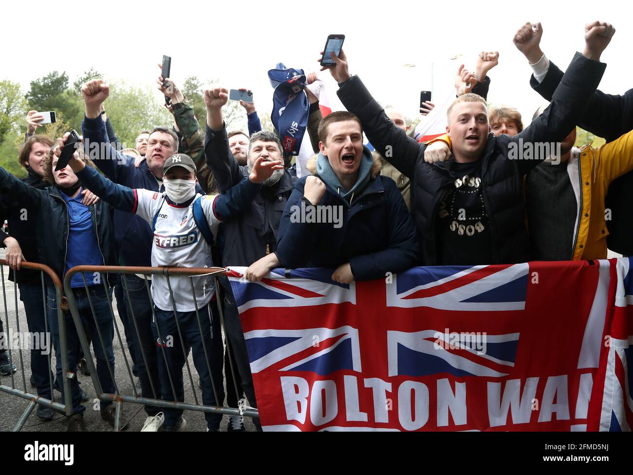 Bolton Wanderers fans gathered outside the ground celebrate sealing ...