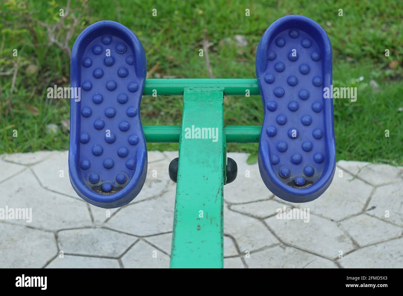Close-up a both blue bubber foot spinning of a Children playing of a ...