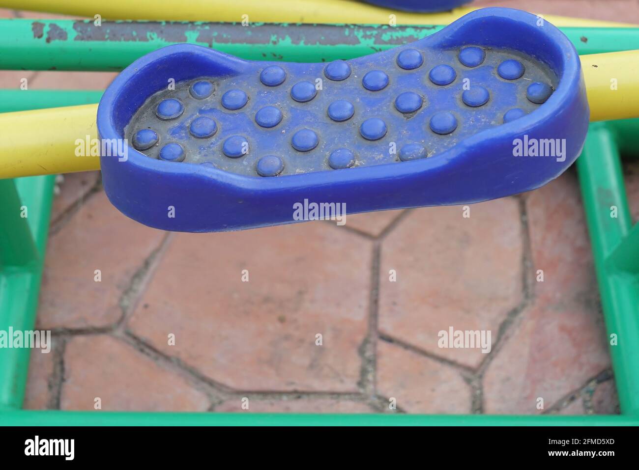 Close-up a blue foot spinning of a Children playing of a playground ...