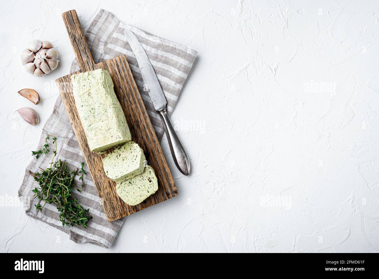 Dairy green butter with herbs set, on white stone background, with copy ...
