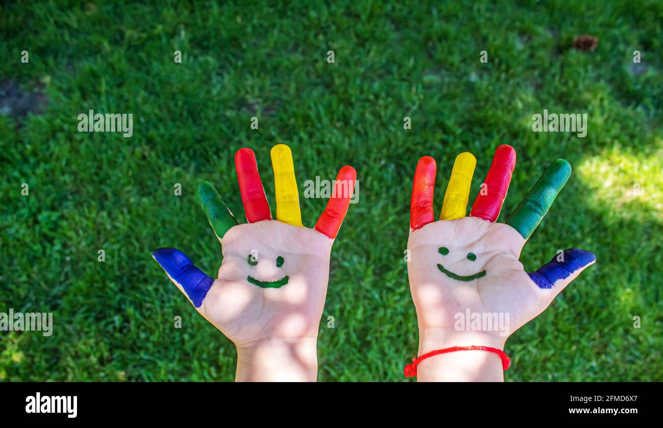 Children's hands in the colors of summer. Selective focus.nature Stock ...